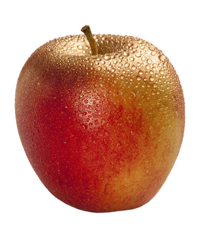 festive gold-plated apple with water droplet , isolatedの写真素材 ...