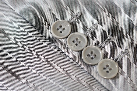 Closeup of suit buttons for business or formal wear, grey color - Stock ...