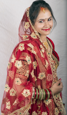 indian beautiful model in traditional bride dress side pose - Stock ...