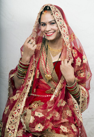 indian beautiful bride laughing pose - Stock Image - Everypixel