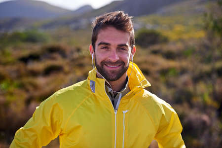 In his element. Shot of a handsome young man in all weather gear posing ...