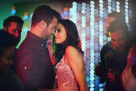 Dancing like nobodys watching. an affectionate young couple dancing on ...