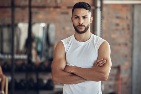 Portrait of bodybuilder with attitude in the gym. Young bodybuilder ...