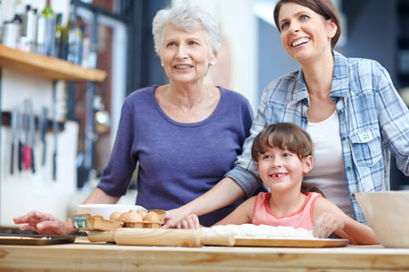 Time to bake some cookies. a three generational family baking together ...