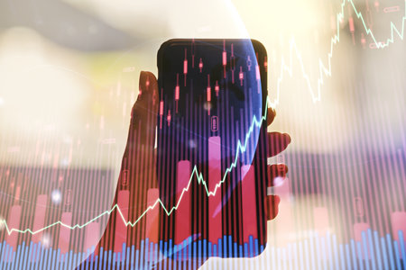 Abstract creative financial graph with world map and hand with mobile ...