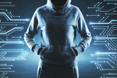 Unrecognizable hacker standing on abstract blue circuit background with binary code. Criminal ...