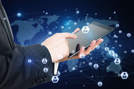 Close up of businessman hand using tablet with abstract glowing digital ...