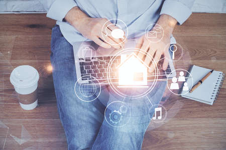 High tech city drawing with businessman working on computer on ...