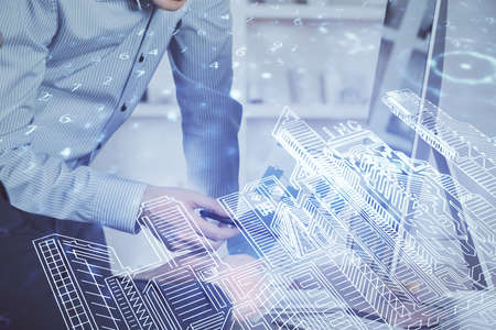 High tech city drawing with businessman working on computer on ...