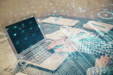 High tech city drawing with businessman working on computer on ...