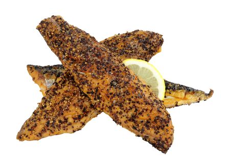 Hot smoked peppered mackerel fillets with crushed peppercorns isolated ...