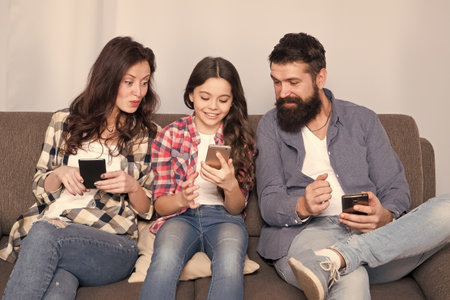 To become blogger is easy. Happy family read new blog in smartphone ...