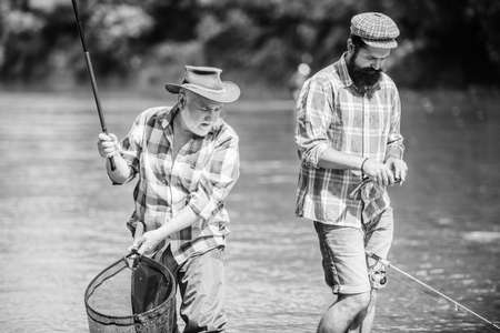 happy day. two happy fisherman with fishing rod and net. hunting ...
