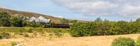 Landscape with steam train of the heritage railway in Blaenavon driving ...