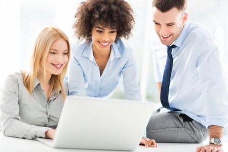 Business people using laptop together - Stock Image - Everypixel