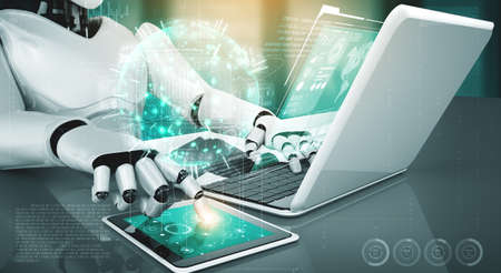 Robot humanoid use laptop and sit at table for global network ...