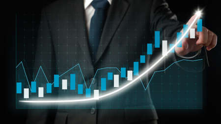 Businessman draw finance allusive graph chart showing business profit ...