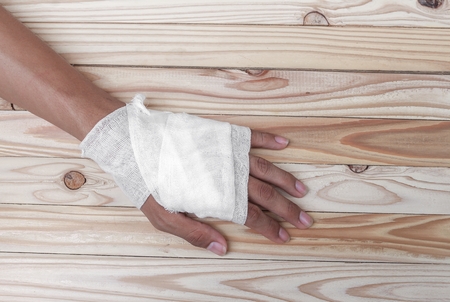 Gauze bandage the hand contusion. treating patients with hand with a ...