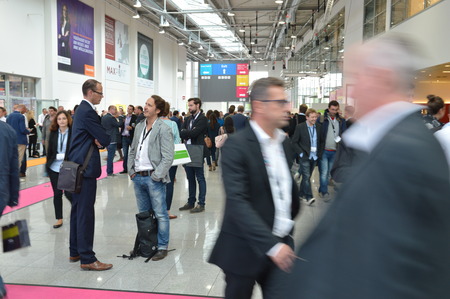 Cologne, Germany - September 16, 2015 - Young business people rushing ...