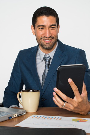 Minority businessman working at his job in an office - Stock Image ...