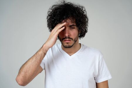 Portrait of young sad man, worried and concerned, looking depressed and ...