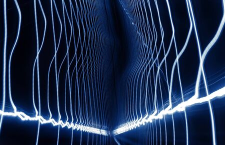 Light trails pattern in metro tunnel, long exposure of movement. Blue ...