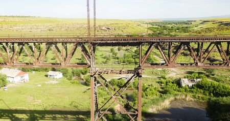 Old metal bridge with a railway over the river - Stock Image - Everypixel