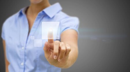 Businesswoman using digital interface with her fingers - Stock Image ...