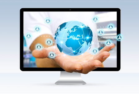 Businessman going out of a computer screen with digital world connected ...