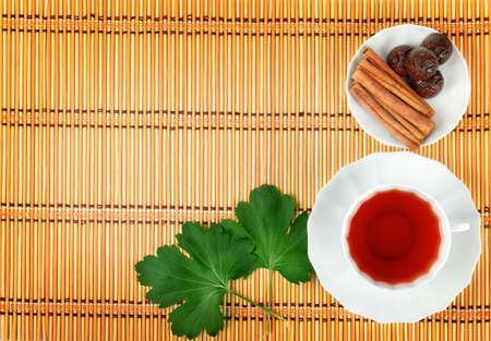 Hot tea with spices on a bamboo mat background - Stock Image - Everypixel