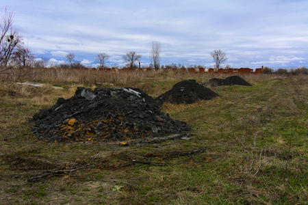 Pile of pulp in the field. Waste from the processing of granite in the ...