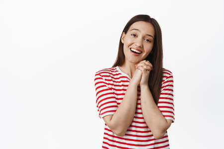 So adorable. Cute brunette girl sighing, looking at something lovely ...