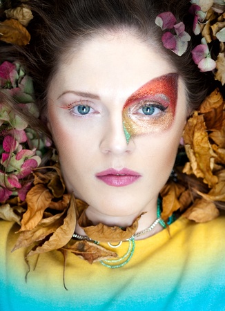 a studio portrait of a young woman with blonde hair and blue eyes ...