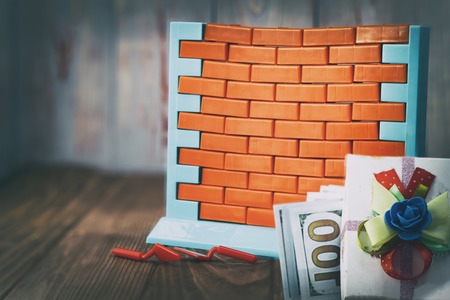 wall toys and red brick. near the gift box with cash dollars. have ...