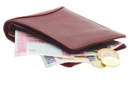 brown leather wallet with banknotes and coils bulging outの写真素材 ...