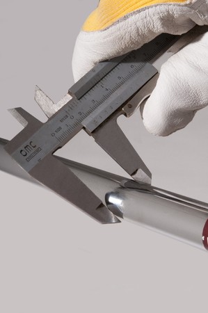 Close-up of man hand using caliperの写真素材 [40007417646] - イメージマート