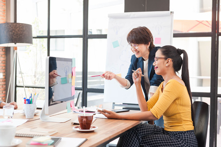 Two senior officer preparing paper work in office of creative work ...