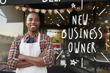 Black male new business owner standing outside coffee shop - Stock ...