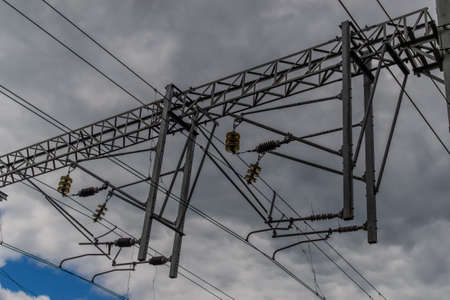 Railway electrification system. Power line wire over rail track. High ...