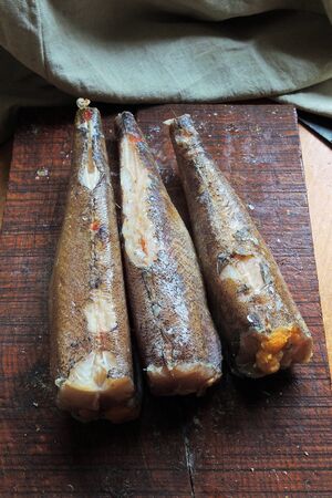 Frozen sea fish on the Board, preparing for cooking, heck - Stock Image ...