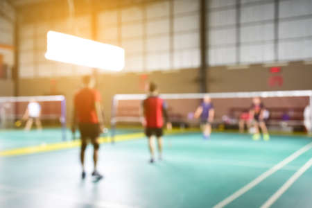 Blurred image of the badminton players and indoor badminton courts in ...