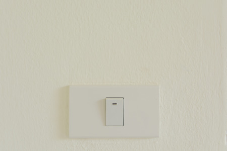 White light switch on wall turn on or turn off the lights, copy space ...