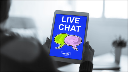 Tablet screen displaying a live chat concept - Stock Image - Everypixel