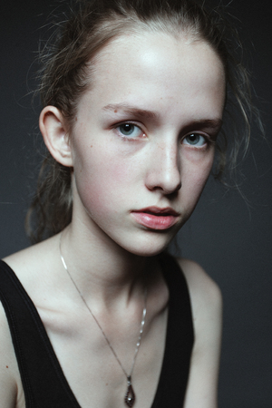 Close-up face portrait of young woman without make-up. Natural image ...