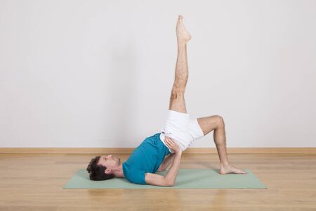 man practicing pilates indoor, return to life sequence, 34 exercise ...