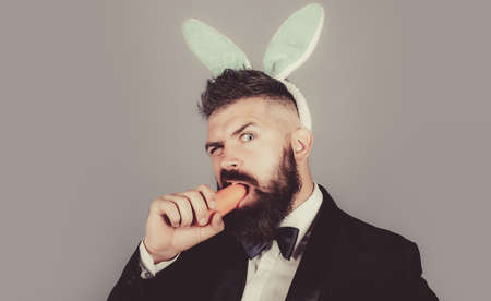 Happy easter and funny easter day. Bunny rabbit man eat carrot. Cute ...
