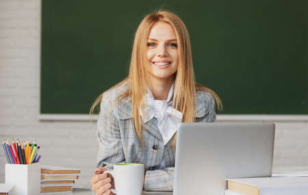 Portrait of happy female university student study lesson at school or ...