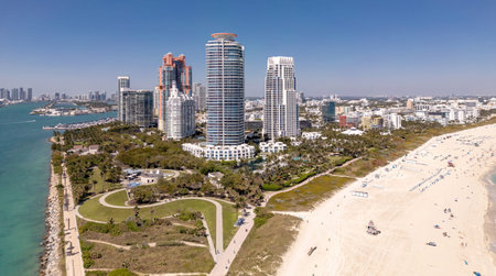Beach in Miami with sunbed on a sandy beach with ocean waves. Miami ...