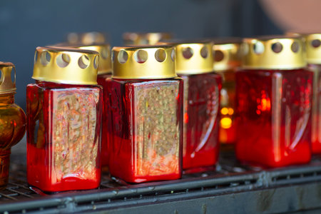 Church candles and lamps for the repose in a catholic church. Christian ...