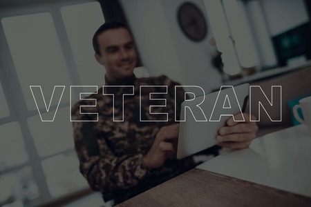 Military Veteran. Disabled Man in a Wheelchair. Man Sitting at Table ...